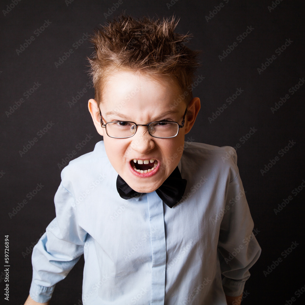Little boy making angry face Stock Photo | Adobe Stock