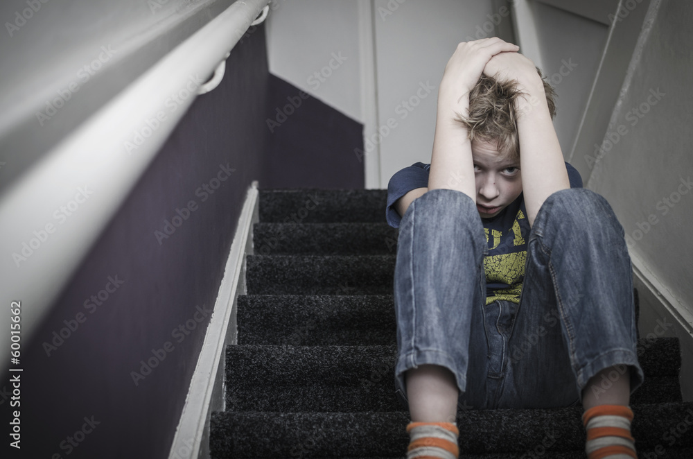 scared boy on stairs, child abuse Stock Photo | Adobe Stock
