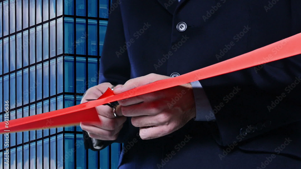 Red ribbon cutting: Hand cutting a red ribbon for inauguration Stock ...