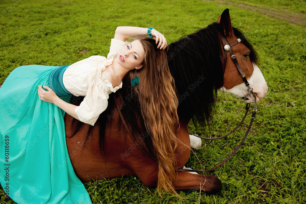 Beautiful woman with a horse in the field. Girl on a farm with a Stock ...