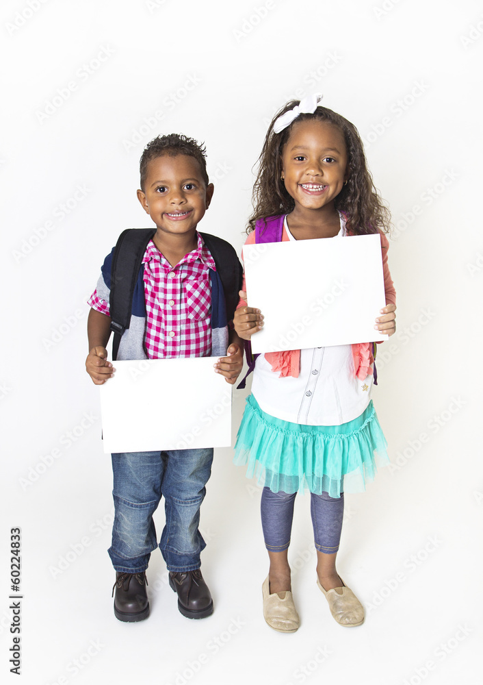 Two cute kids holding up a blank sign Stock-Foto | Adobe Stock