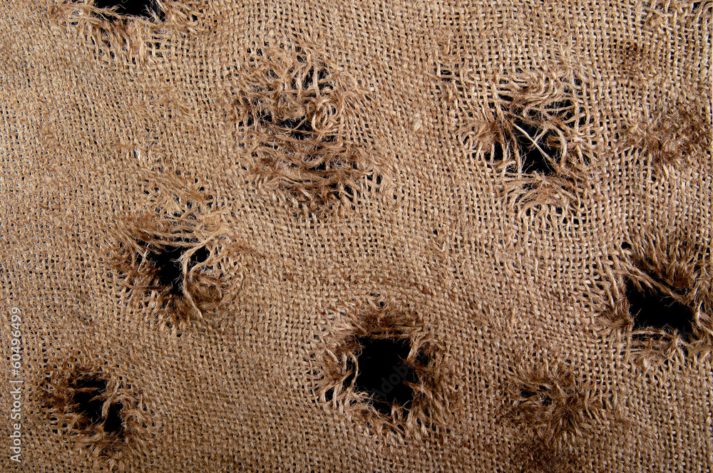 Torn burlap decayed. Ragged linen fabric. Stock Photo | Adobe Stock