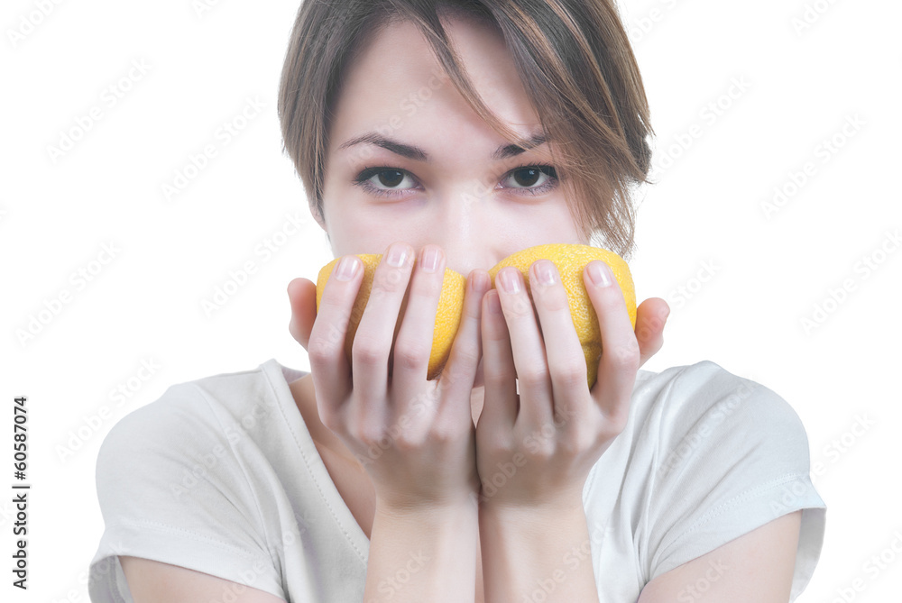 Girl sniffing two parts of lemon Stock Photo | Adobe Stock