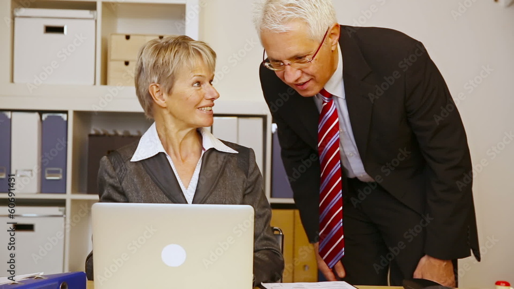 Business man helping woman in office Stock Video | Adobe Stock