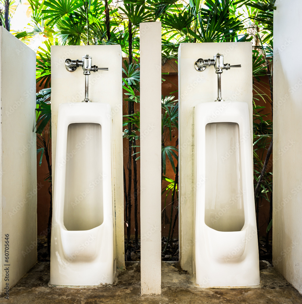 restroom interior design with white urinal row Stock Photo | Adobe Stock