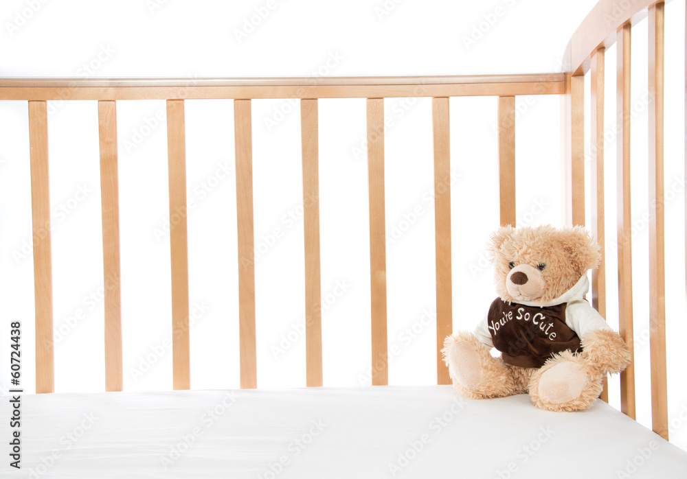 Baby bed with teddy bear for child Stock Photo | Adobe Stock