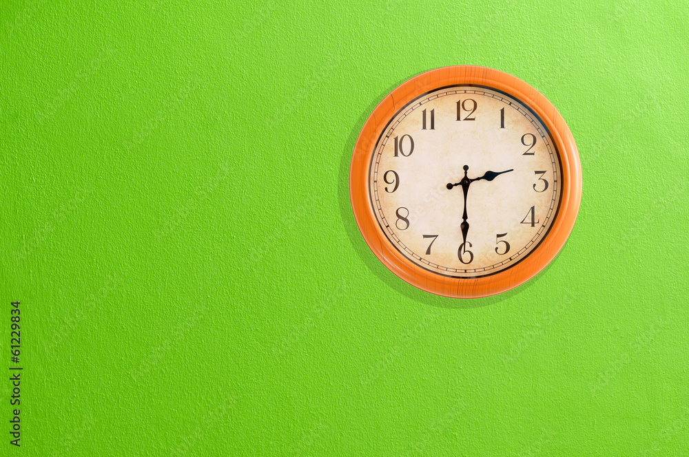 Clock showing 02:30 on a green wall Stock Photo | Adobe Stock