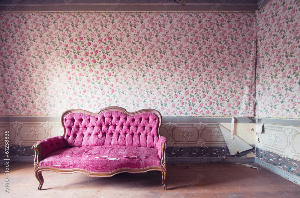 Old damaged red couch in an antique house. Flowers wallpaper Stock ...