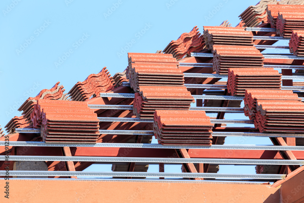 roof under construction with stacks of roof tiles for home build Stock ...