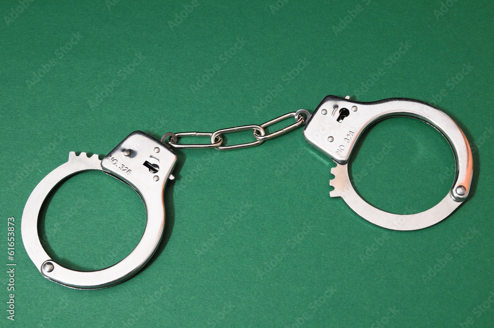 Pair of Handcuffs Stock Photo | Adobe Stock