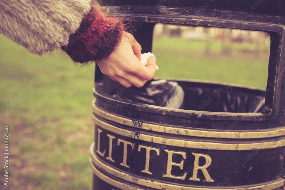 Throwing something in the litter Stock Photo | Adobe Stock