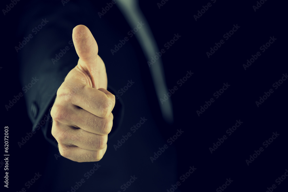 Thumbs up gesture of approval and success Stock Photo | Adobe Stock