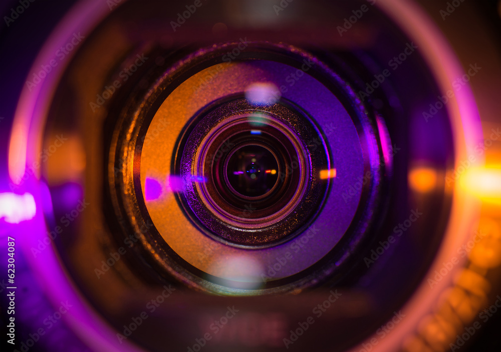 Video camera lens closeup lit by orange and purple neon light Stock ...