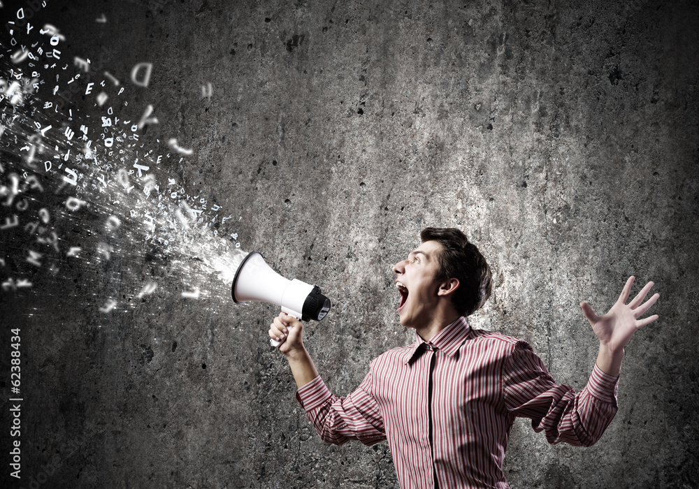 Guy with megaphone Stock Photo | Adobe Stock