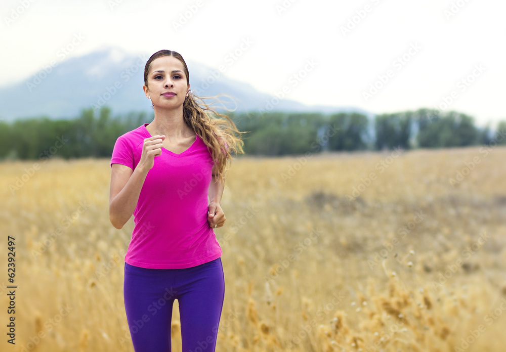 Beautiful Woman Jogging outdoors Stock Photo | Adobe Stock