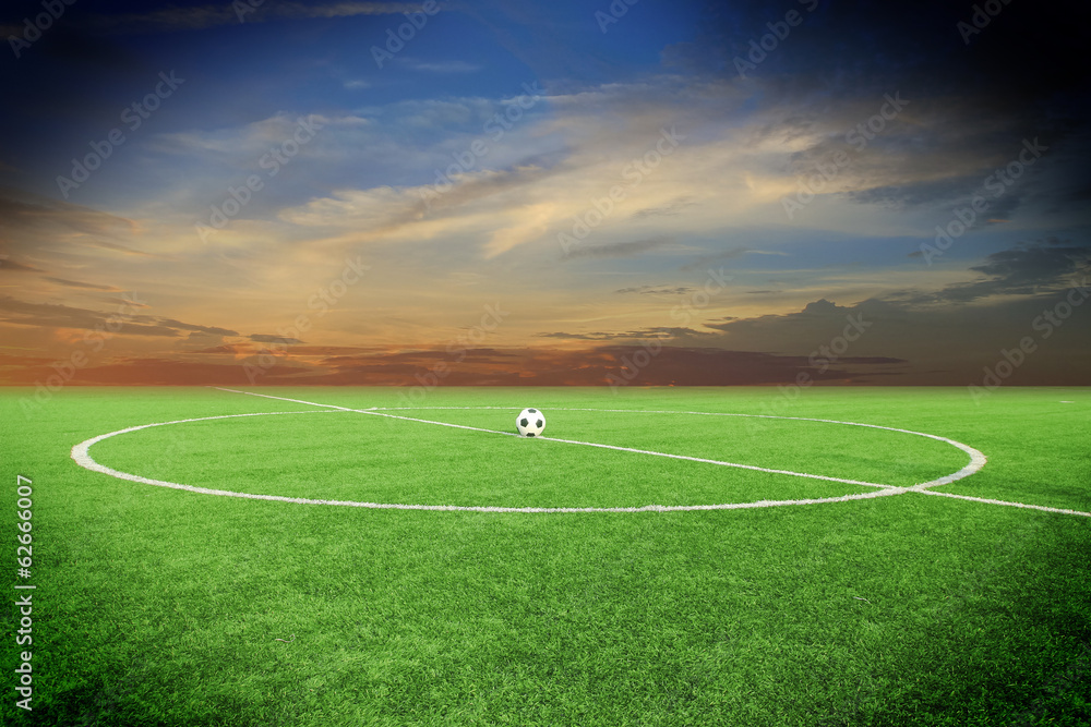 soccer ball on soccer field with sun set Stock Photo | Adobe Stock