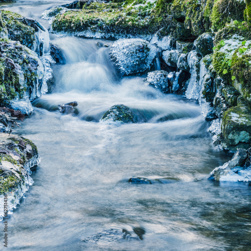 Small creek with a waterfall close up Stock Photo | Adobe Stock