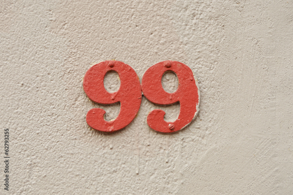 Foto de House Number ninety-nine sign do Stock | Adobe Stock
