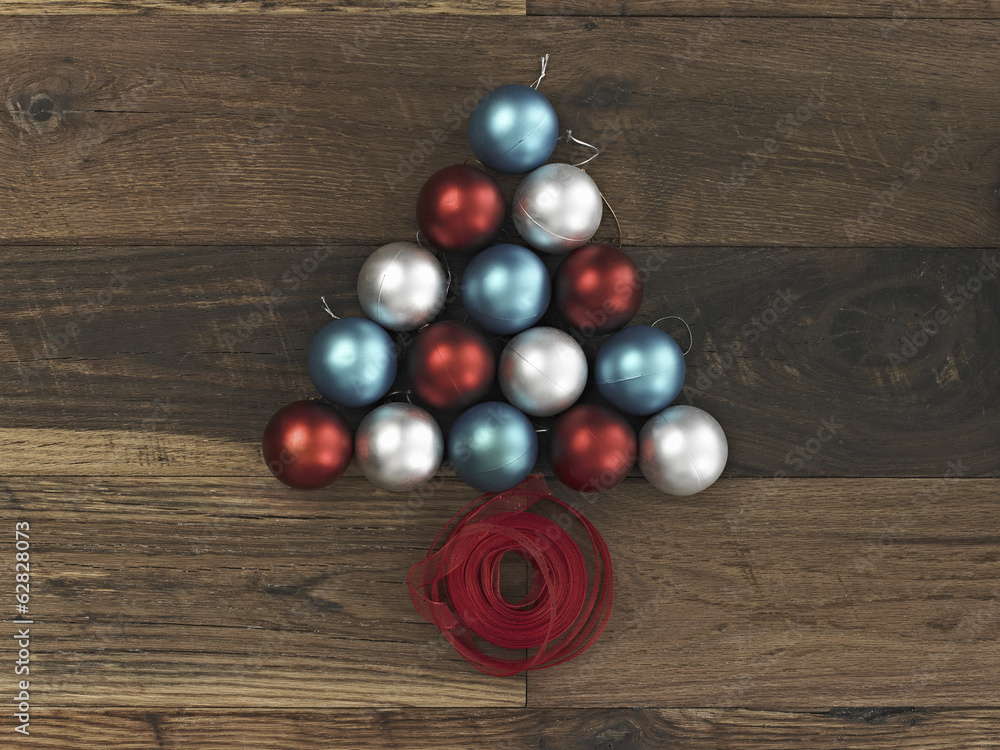 A collection of blue, red and silver ornaments arranged in a triangular ...
