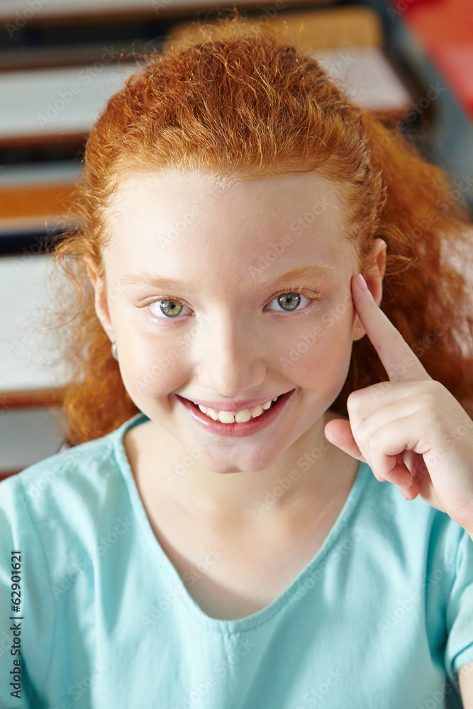 Girl having idea in school class Stock Photo | Adobe Stock