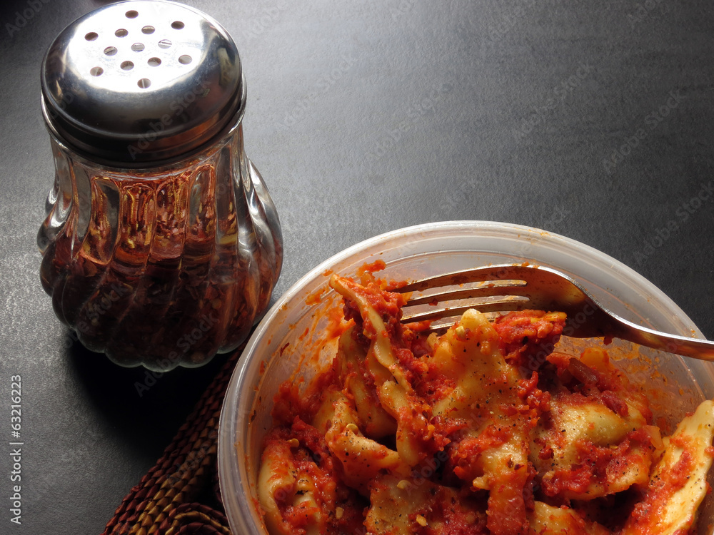 Small bowl of Ravioli with Chiles sprinkled on top Stock Photo | Adobe ...