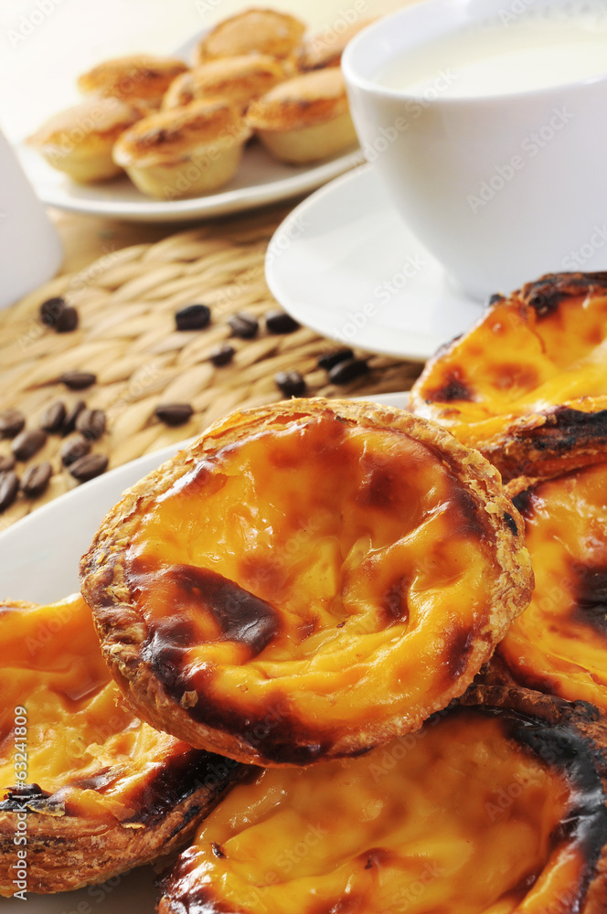 pasteis de nata and pasteis de feijao, typical Portuguese pastri Stock ...