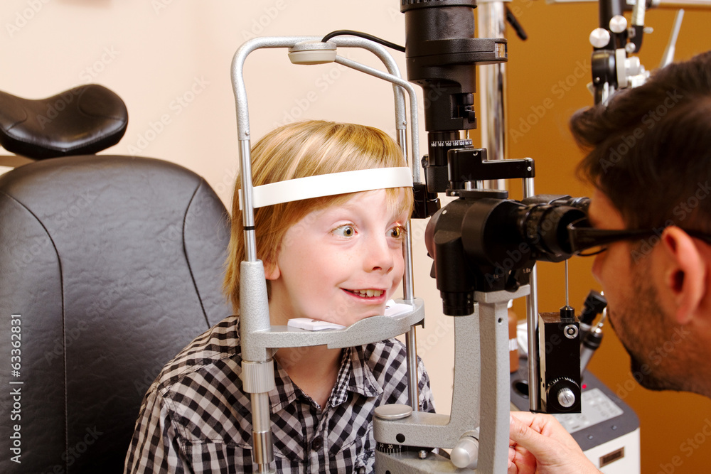 Child opening eyes wide for examination Stock Photo | Adobe Stock