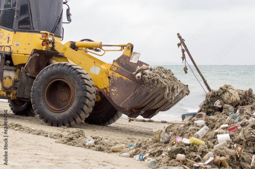 tractor cleaning with clean up Garbage on the seashore on trail Stock ...