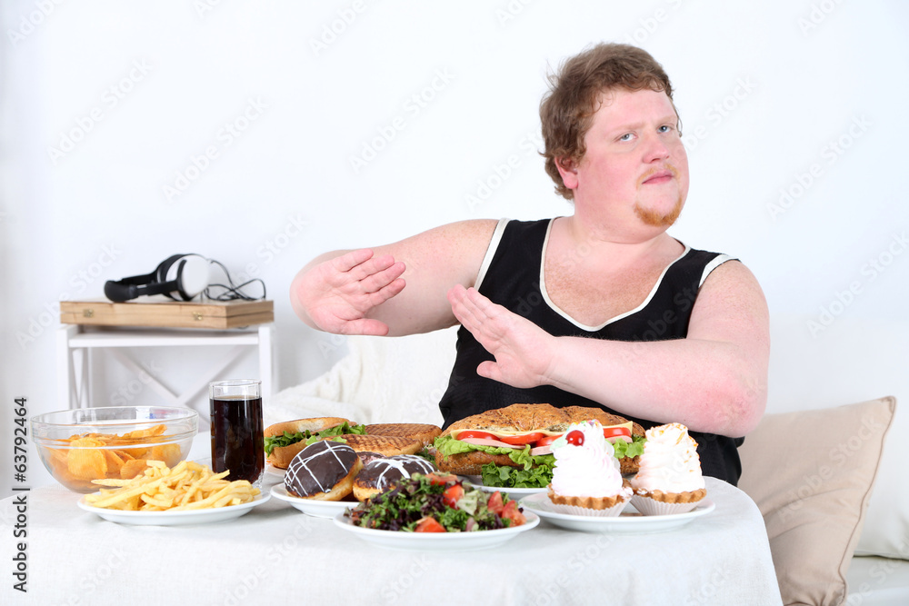 Fat man do not want to eat a lot of unhealthy food, Stock Photo | Adobe ...
