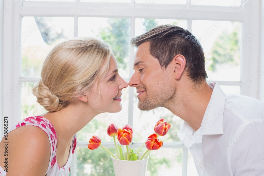 Side view of a romantic couple rubbing noses Stock Photo | Adobe Stock