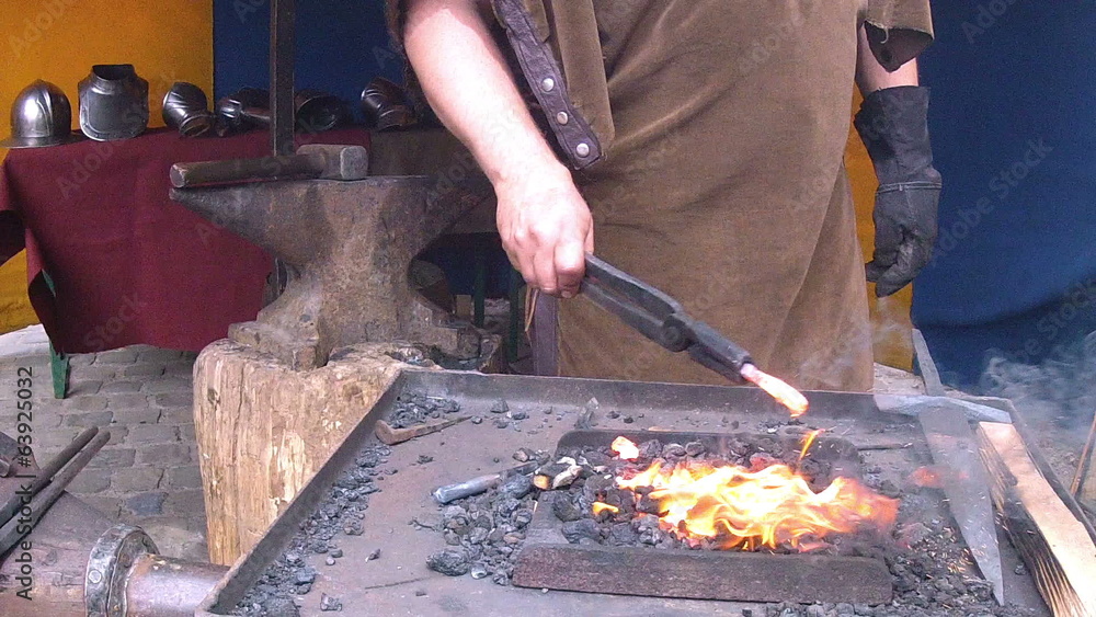 Medieval tradition of making armor and swords at the forge. Stock 비디오 ...