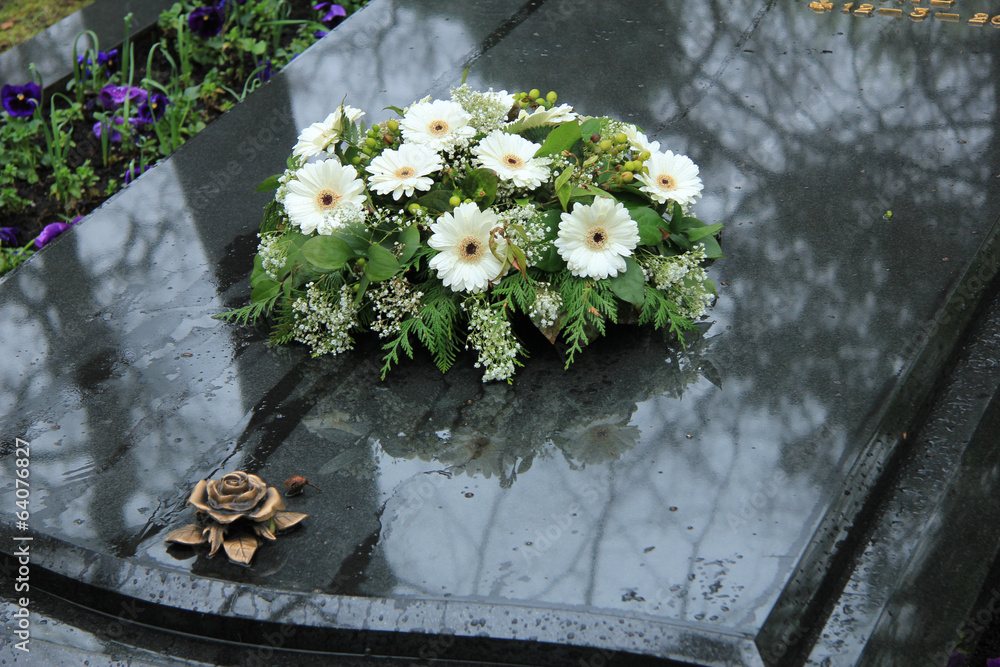 Funeral flowers on a tomb Stock Photo | Adobe Stock