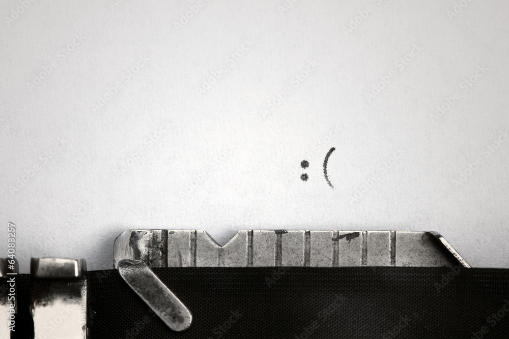 Sad smiley emoticon written on an old typewriter Stock Photo | Adobe Stock