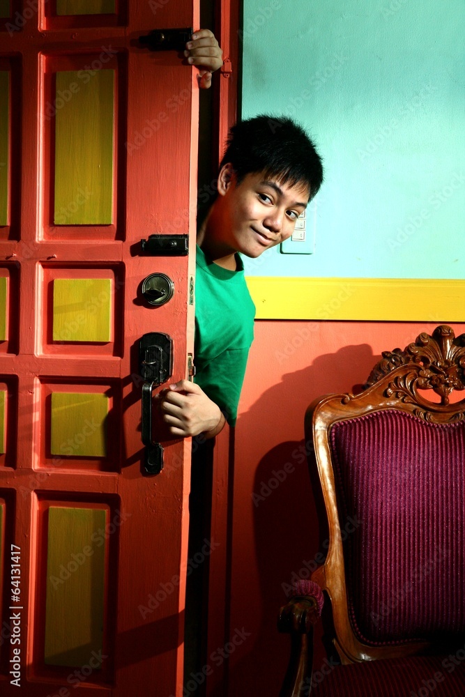 Young asian teen peeking and sneaking in into a living room Stock Photo ...