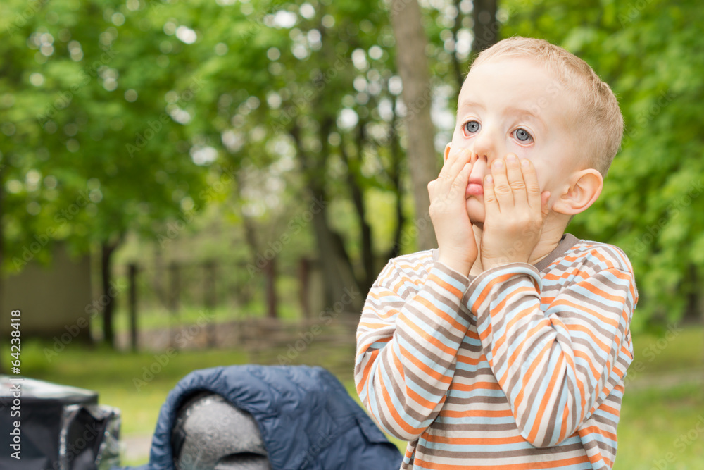 Little boy pulling a droopy eyed face Stock Photo | Adobe Stock