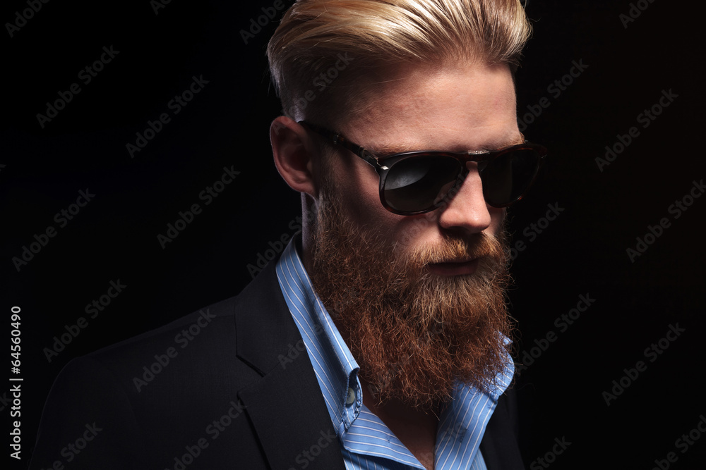 bearded business man looks down Stock Photo | Adobe Stock