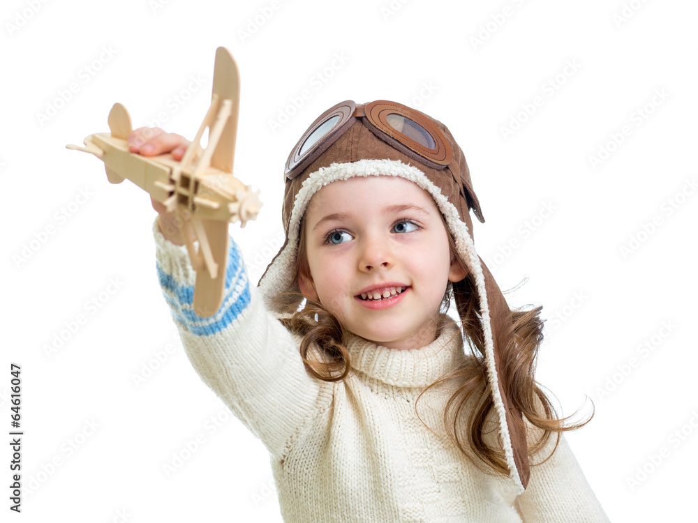 child dressed as pilot and playing with wooden airplane toy isol Stock ...