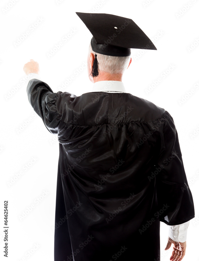 Rear view of a senior male graduate pretending to work on virtua Stock ...
