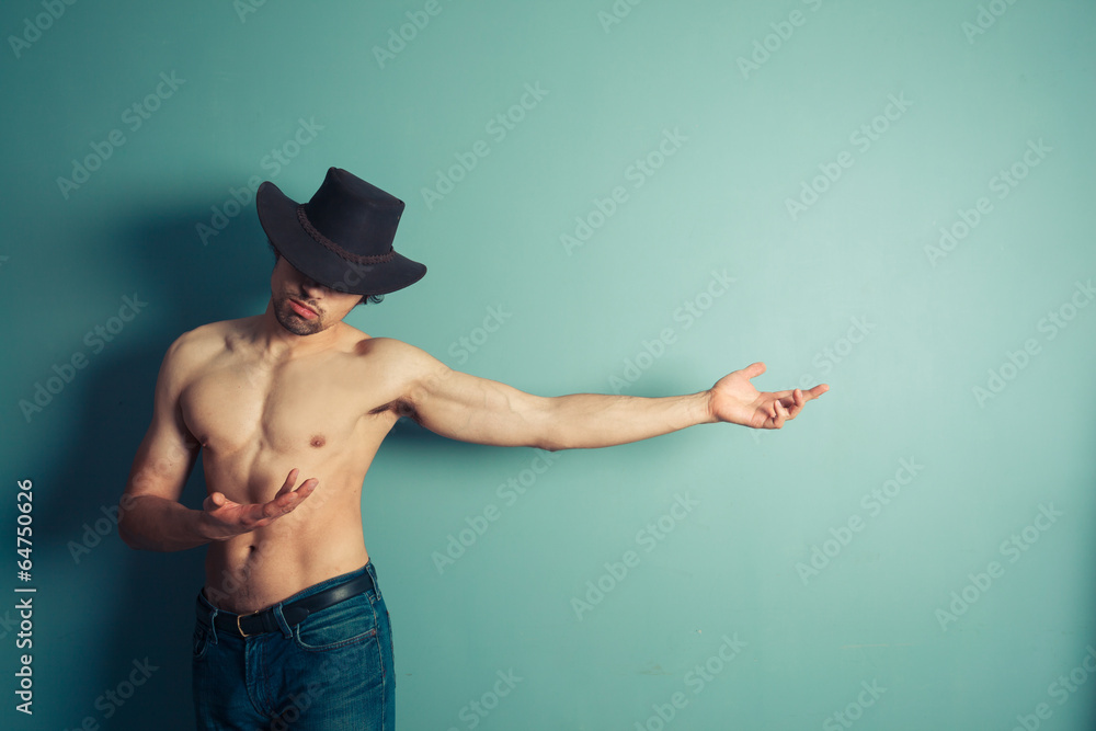 Sexy shirtless cowboy pointing Stock Photo | Adobe Stock