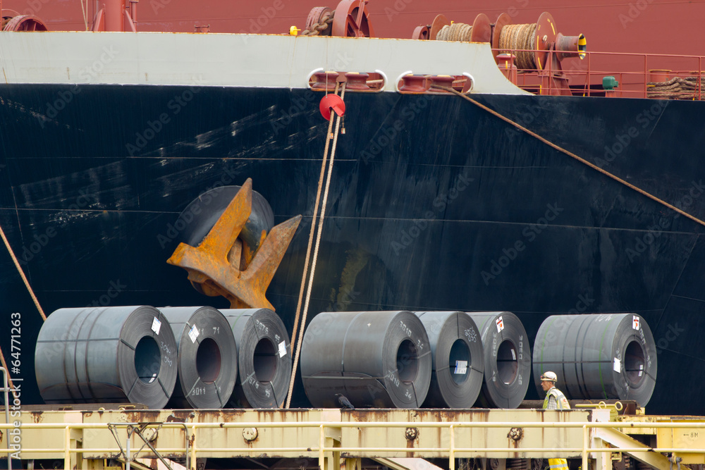 Coiled steel sheets being loaded in a ship Stock Photo | Adobe Stock