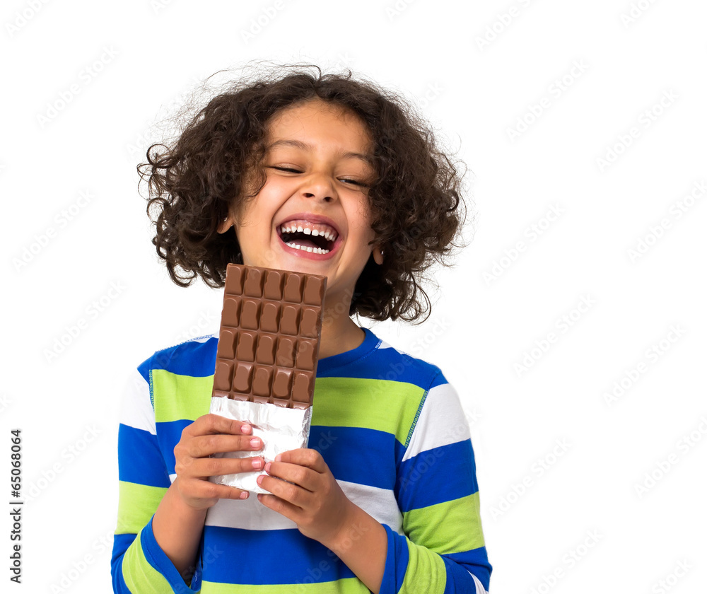 Little girl eating chocolate Stock Photo | Adobe Stock