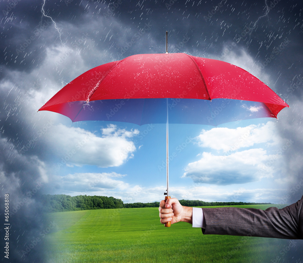 Hand with an red umbrella Stock Photo | Adobe Stock