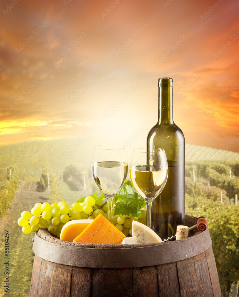 Wine still life with vineyard on backgorund Stock Photo | Adobe Stock