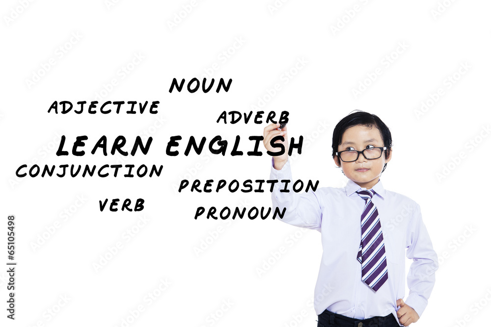 Schoolboy writes english language materials Stock Photo | Adobe Stock