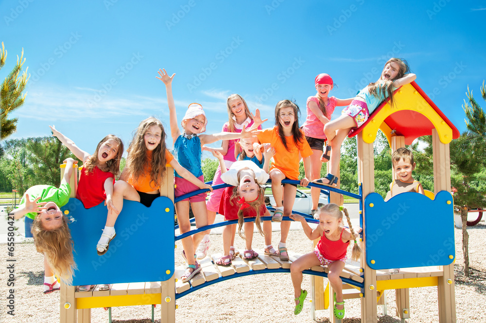 Happy kids playing on playground Stock Photo | Adobe Stock