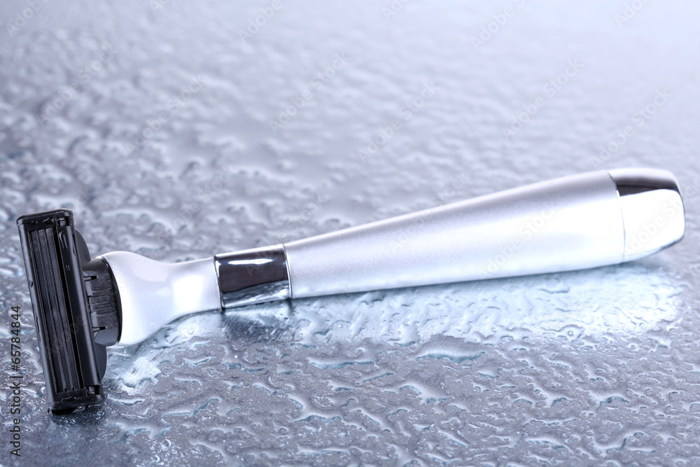 Shaving razor on gray background Stock Photo | Adobe Stock