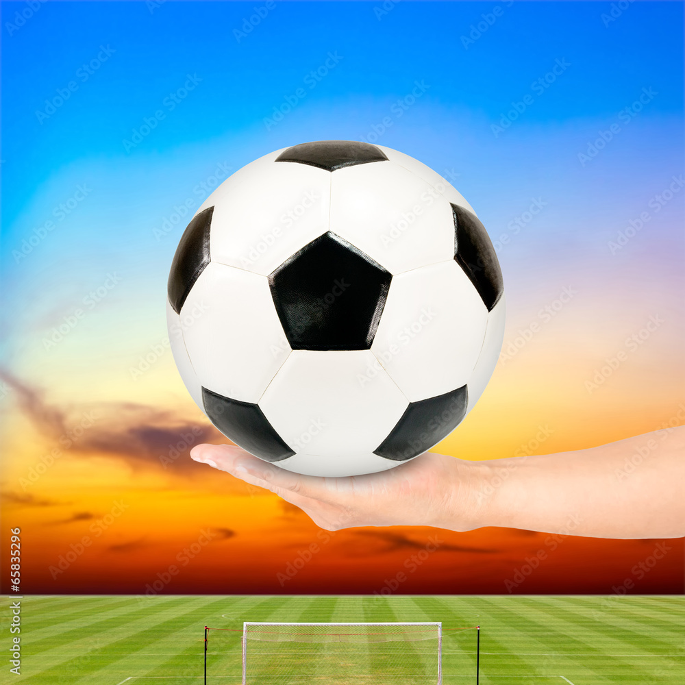 Soccer Ball On Field At Sunset