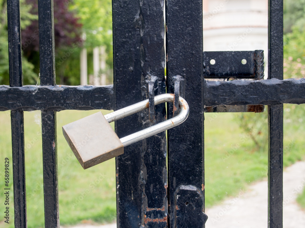 Padlock and gate Stock Photo | Adobe Stock