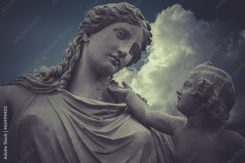Woman and child Greek sculptures over clouds background Stock Photo ...