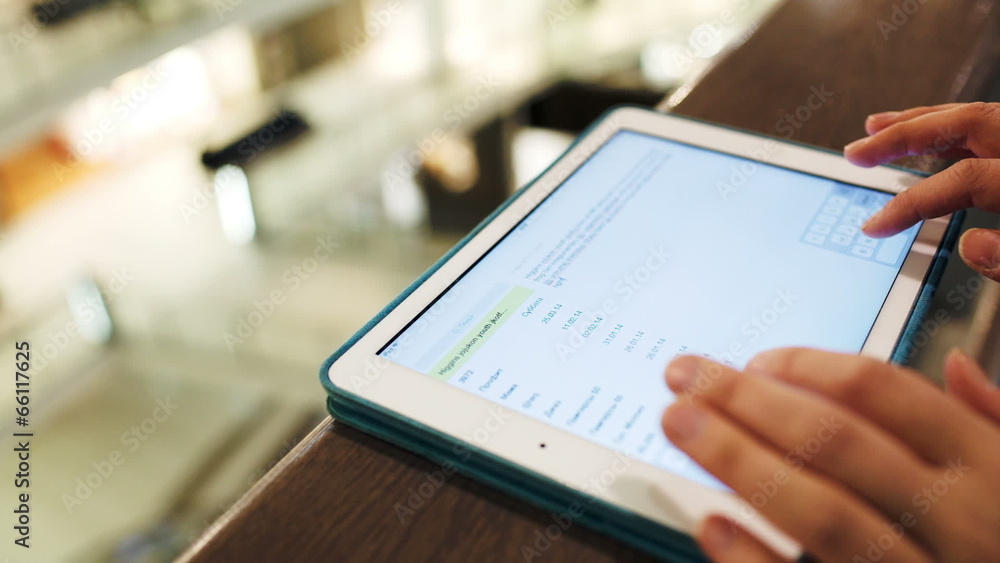 Womans hands using pad on rails in trade center Stock Video | Adobe Stock